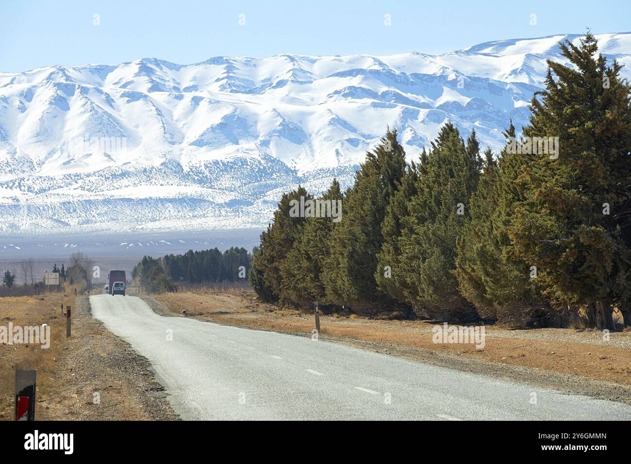 Road leading to the snow-capped Atlas mountains, Morocco, Africa Stock ...