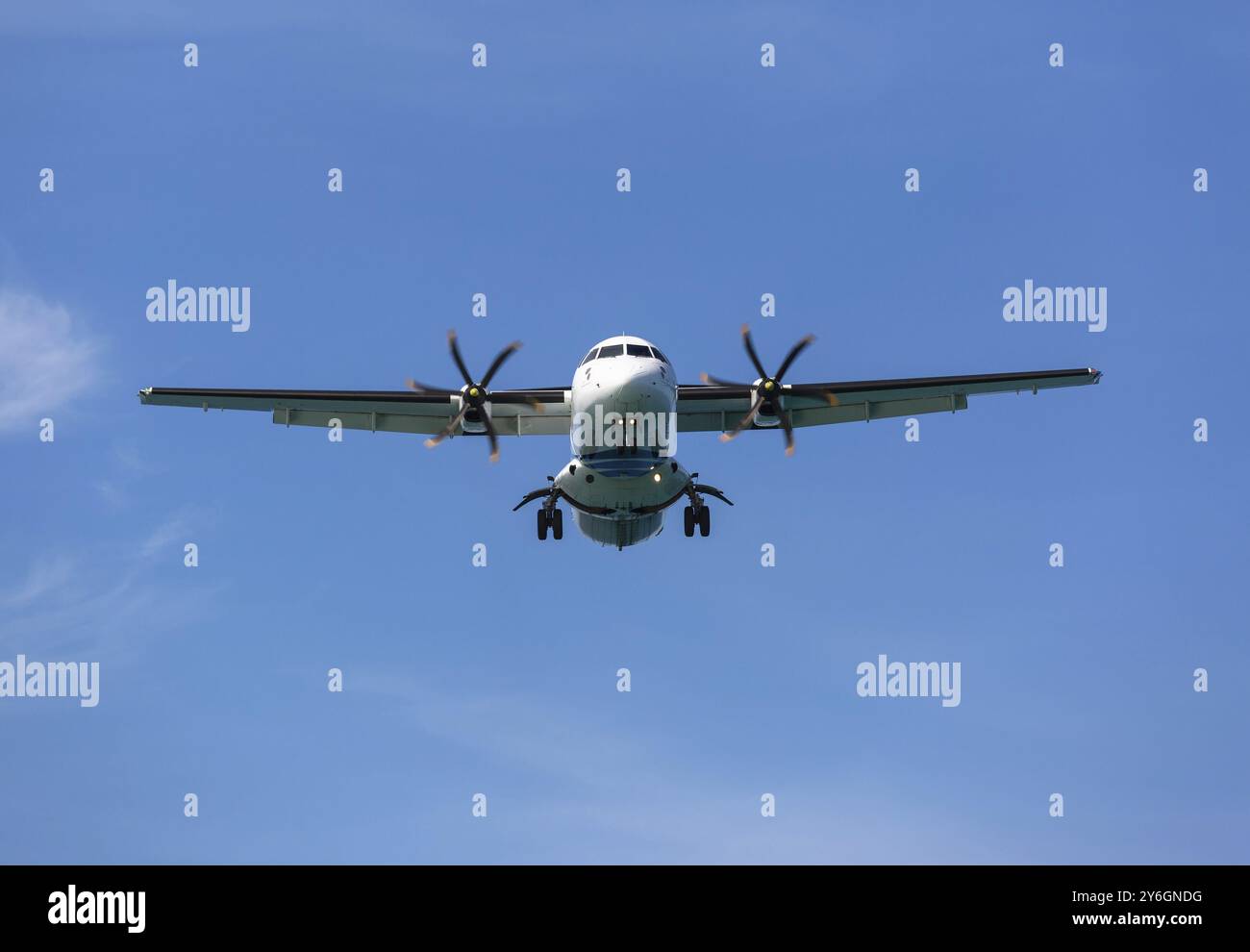 Passenger propeller airplane in the sky before landing Stock Photo - Alamy