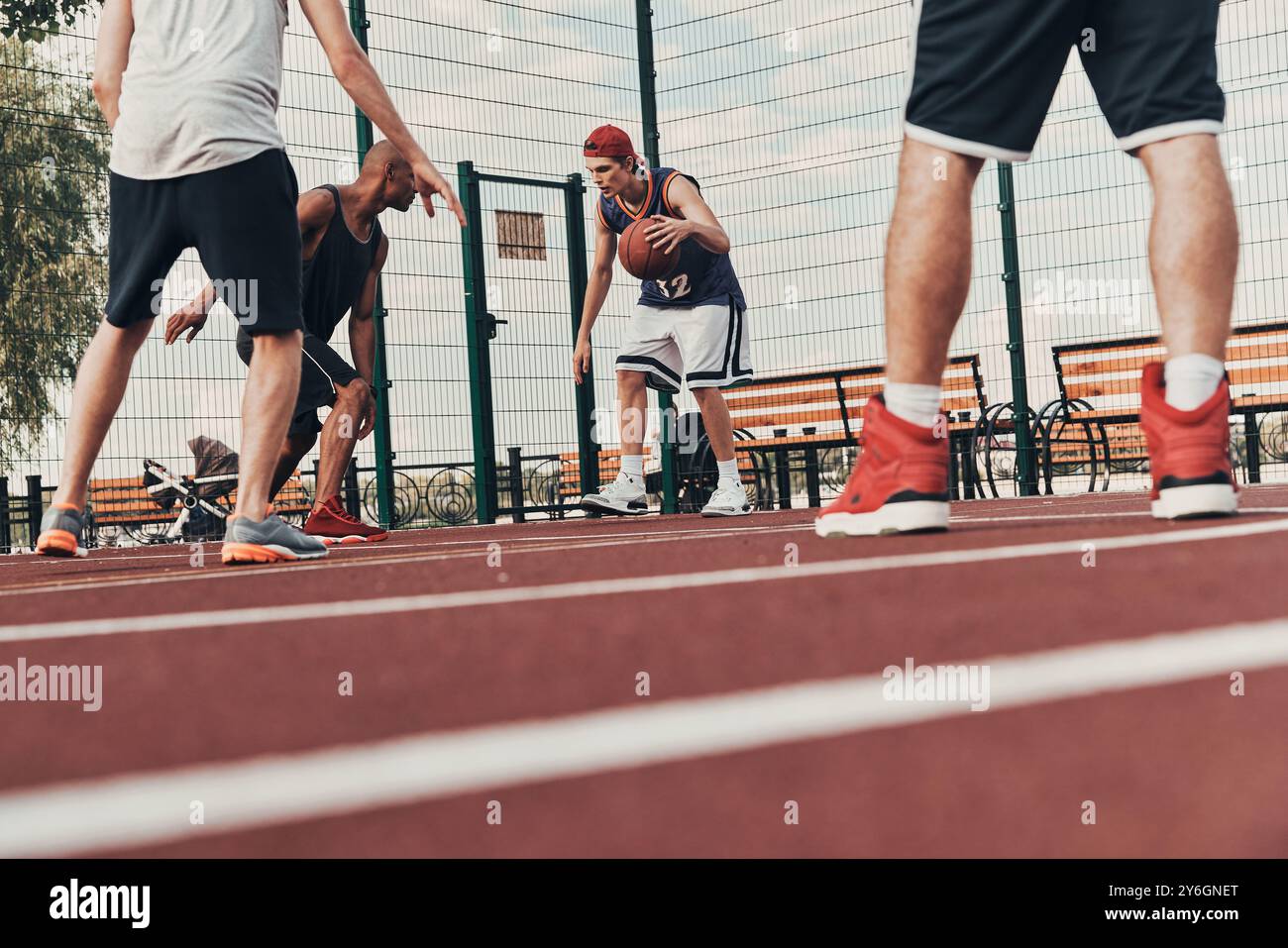 Winners never quit. Group of young men in sports clothing playing ...