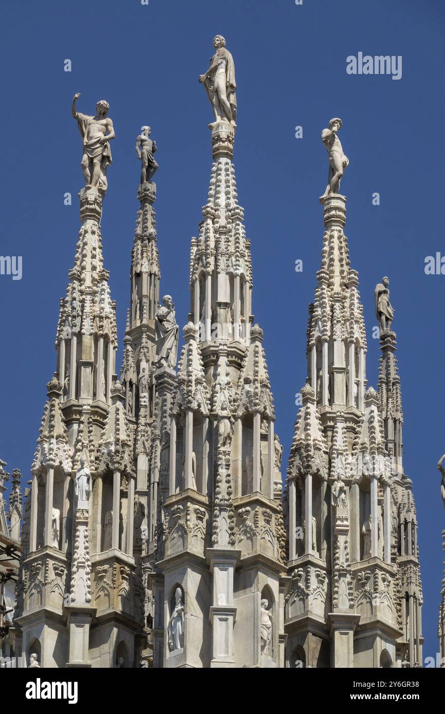 Marble statues, architecture on top of roof Duomo gothic cathedral in ...