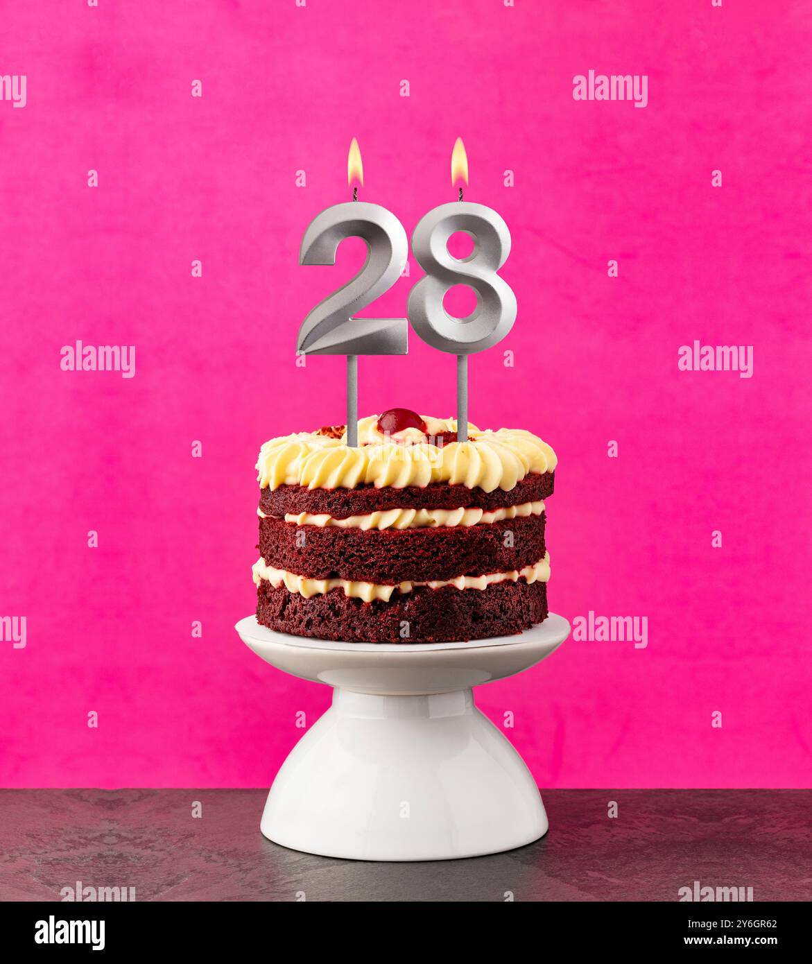 Red velvet cake - Birthday number 28 on a pink background Stock Photo ...