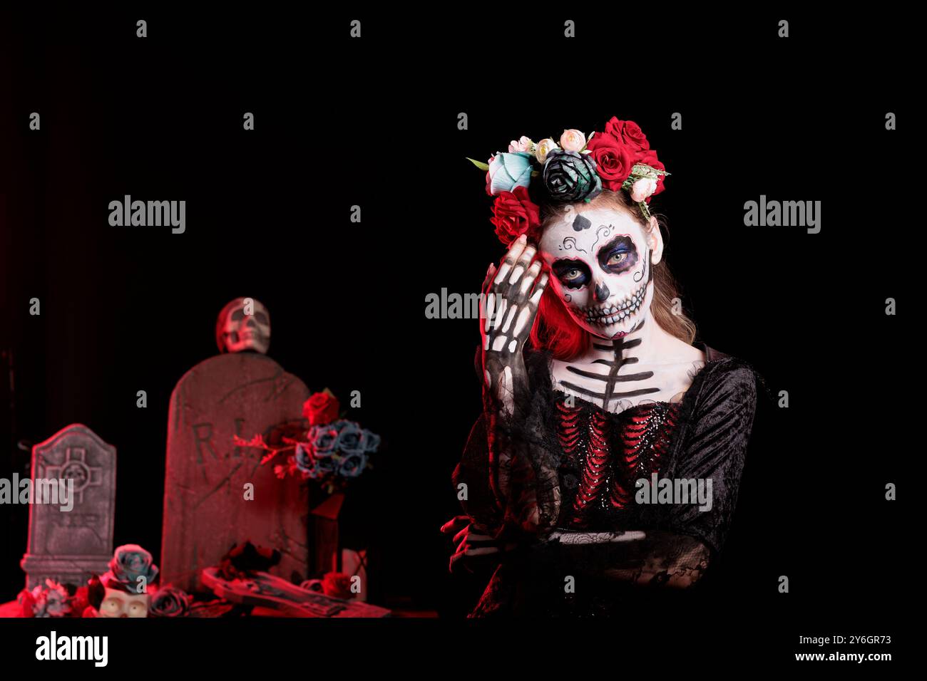 Portrait of person wearing skull makeup and horror costume to celebrate ...