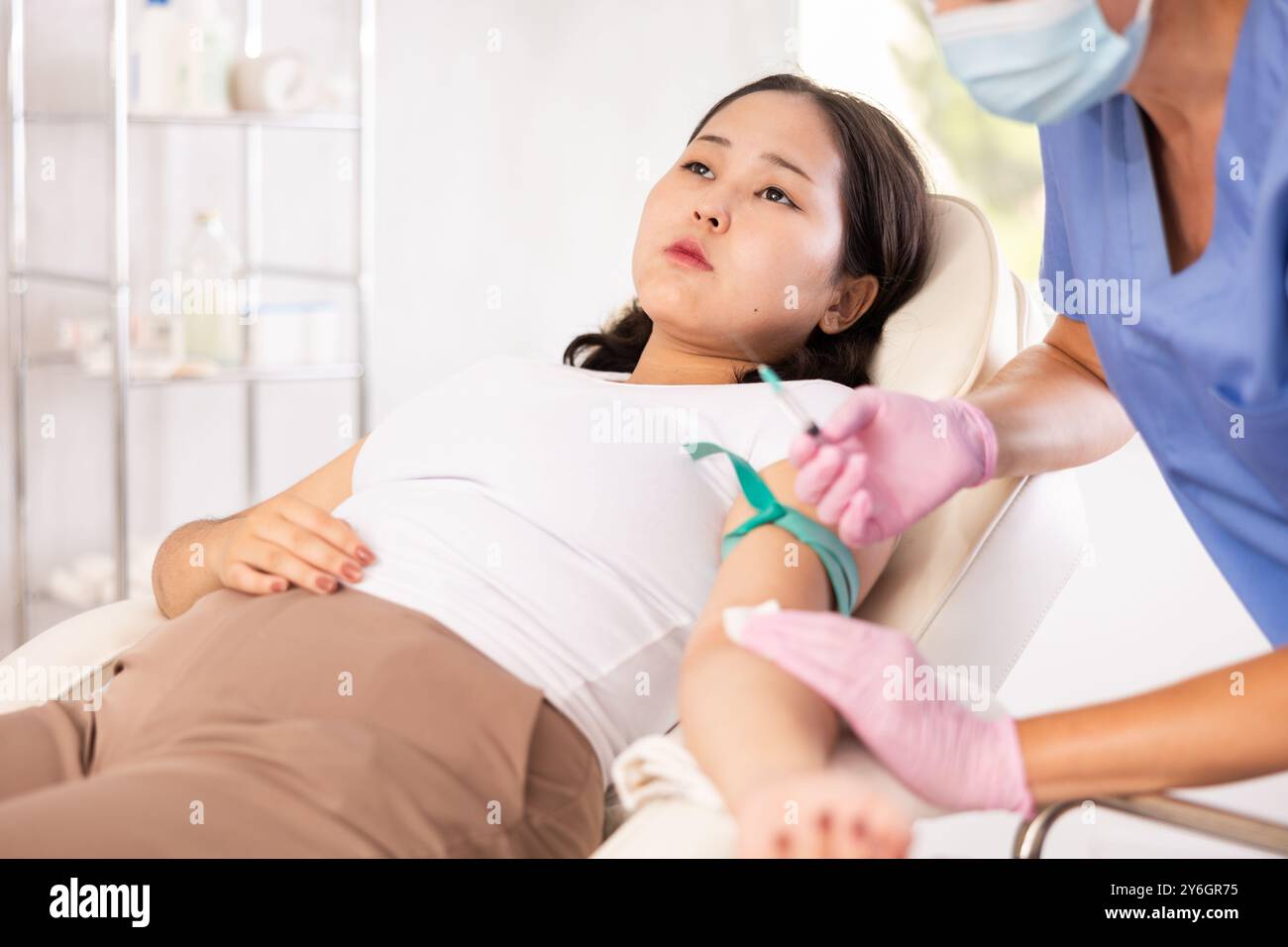 Doctor drawing blood from the elderly woman vein Stock Photo - Alamy
