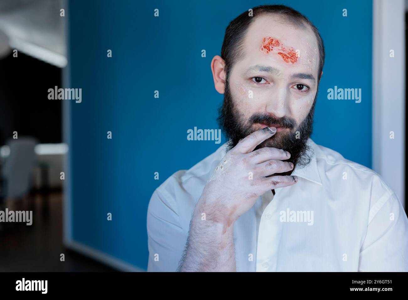 Portrait of actor portraying zombie character in horror movie ...