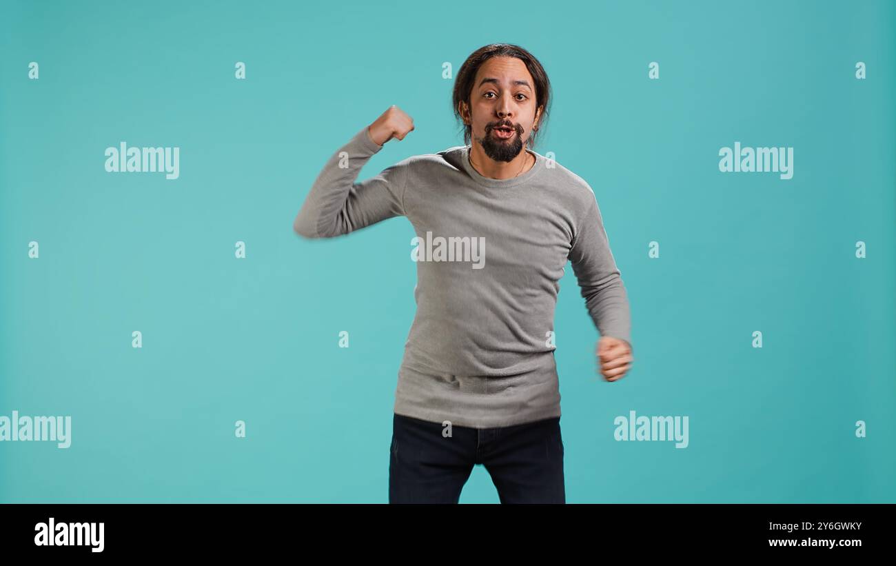 Man jumping from joy in excitement while cheering for favorite sports ...