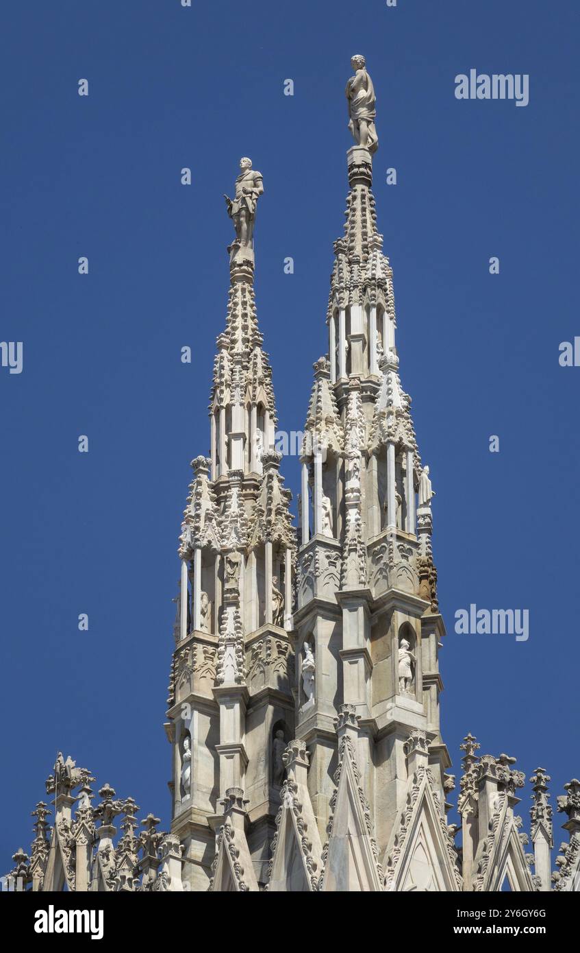 Marble statues, architecture on top of roof Duomo gothic cathedral in ...