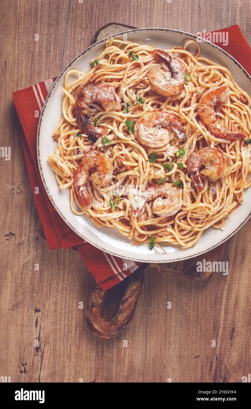 Food photography, Spaghetti with tiger prawns, in tomato sauce ...