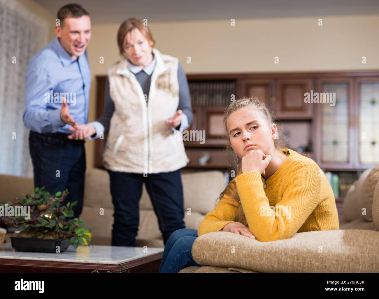 Woman and man lecturing teenage girl Stock Photo - Alamy