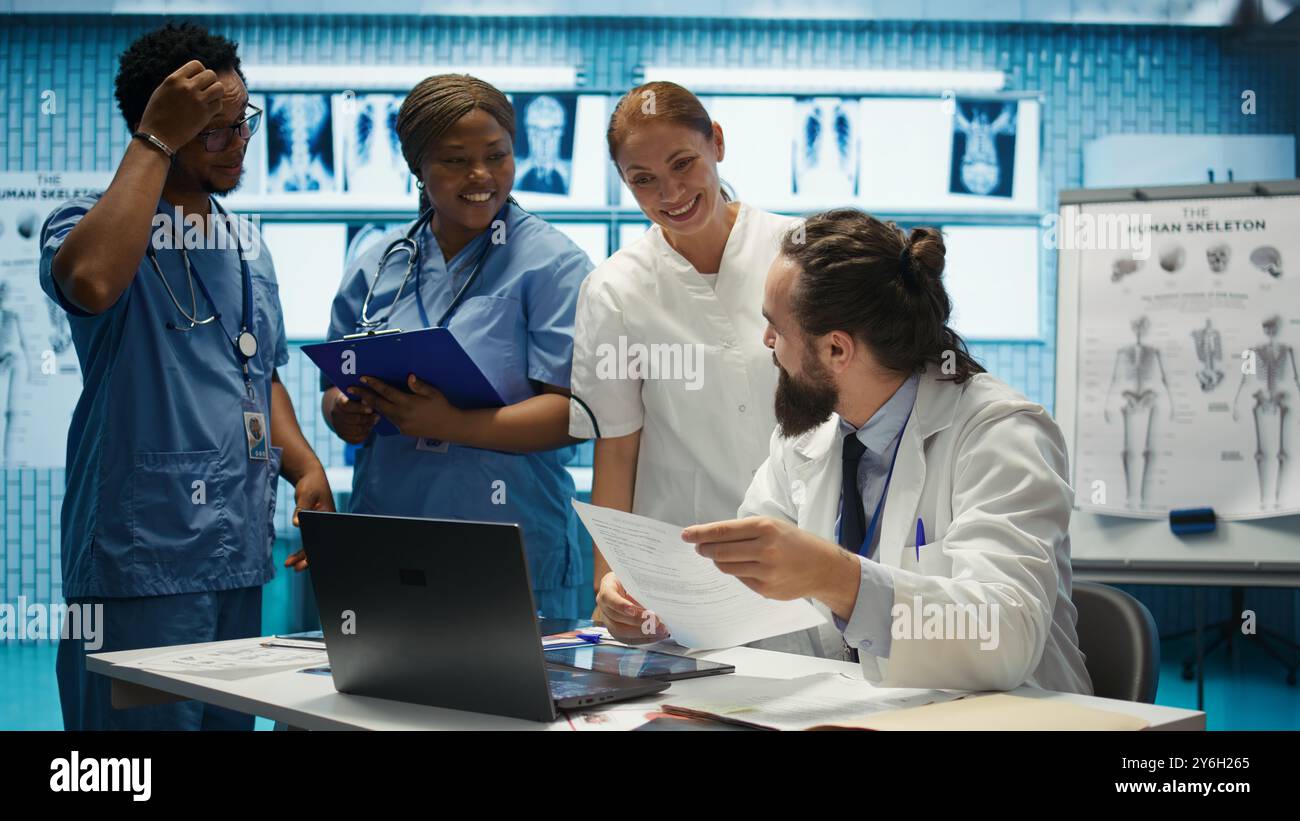 Confident pleased medical staff sharing a high five to celebrate their ...