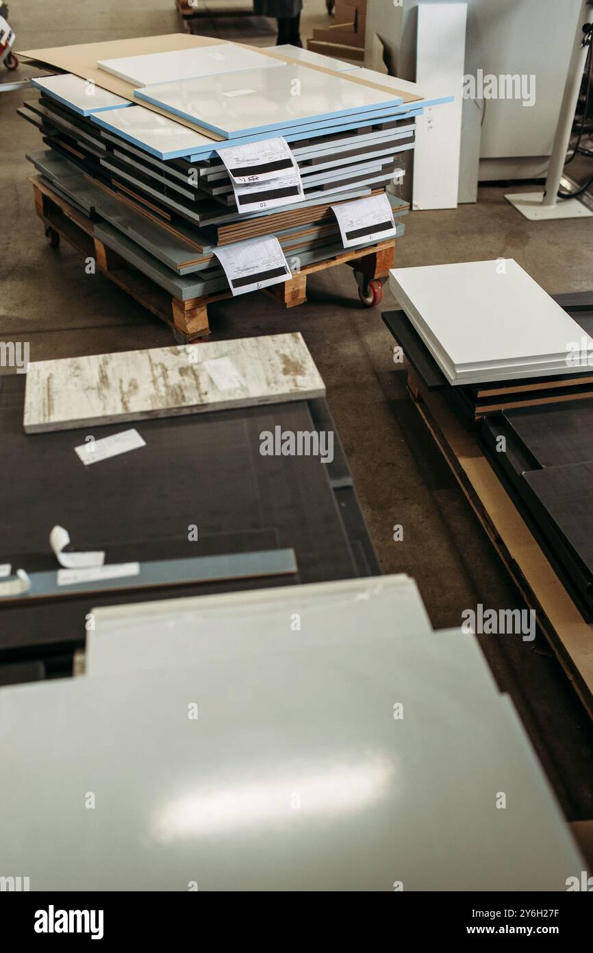 Various wood panels stacked on a pallet ready for use in furniture ...