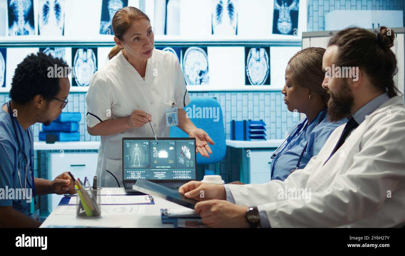 Team of doctors review electrocardiogram test results at a private ...