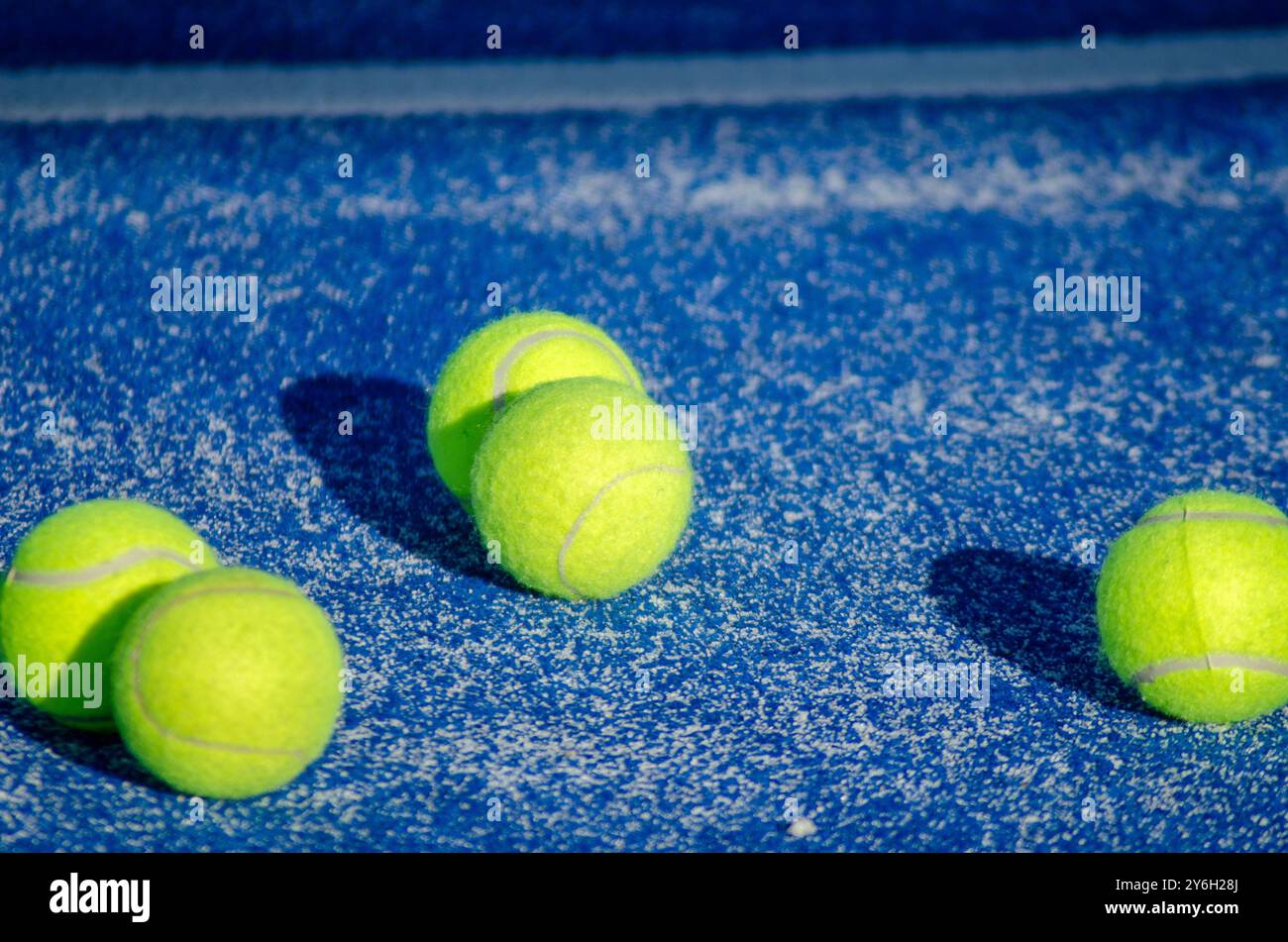 close up view of five balls ina blue padel tennis court Stock Photo - Alamy