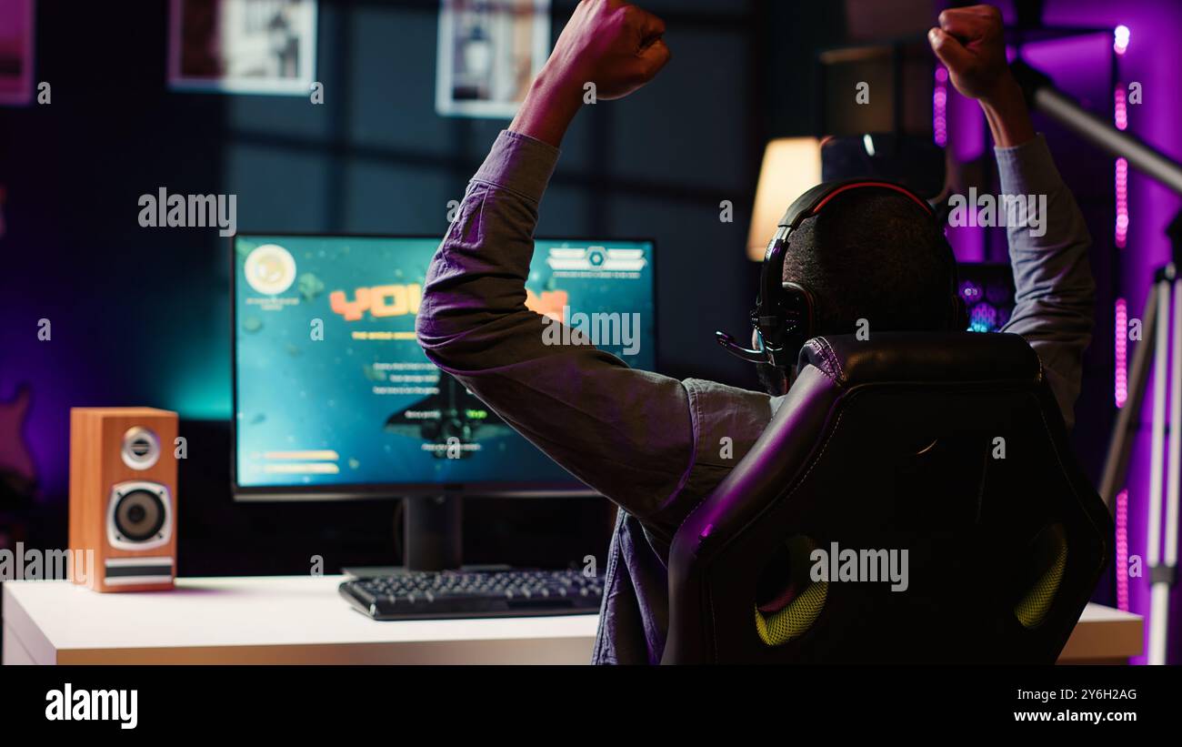 Gamer feeling overjoyed after winning hi-res stock photography and ...