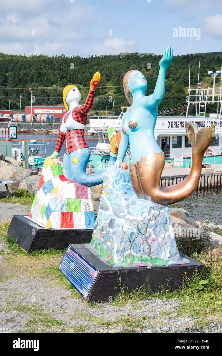 O'Brien's blue and red mermaid statues in Bay Bulls, Newfoundland ...