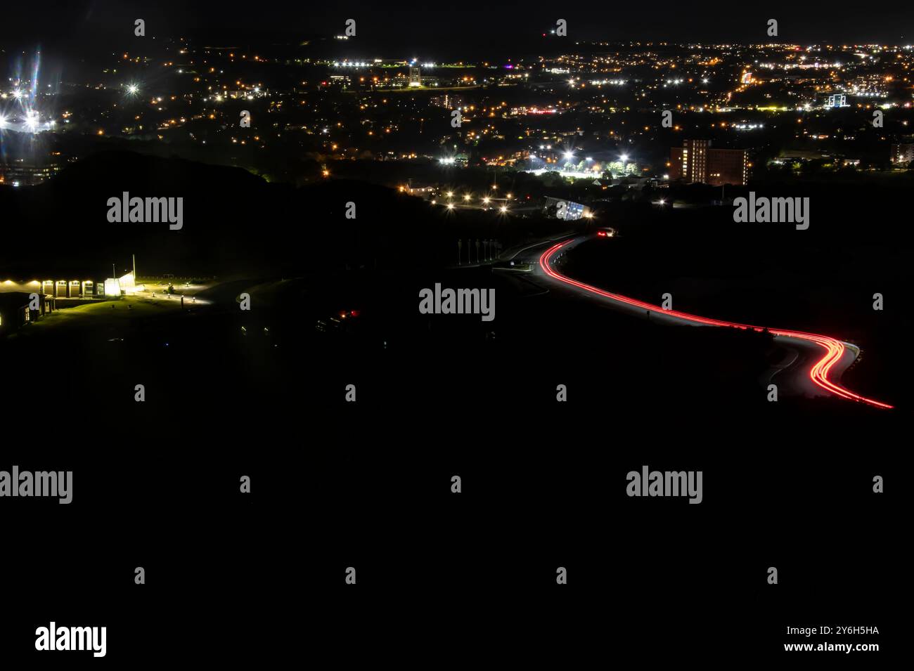 Car trails on Signal Hill Road at night in St. John's, Newfoundland ...