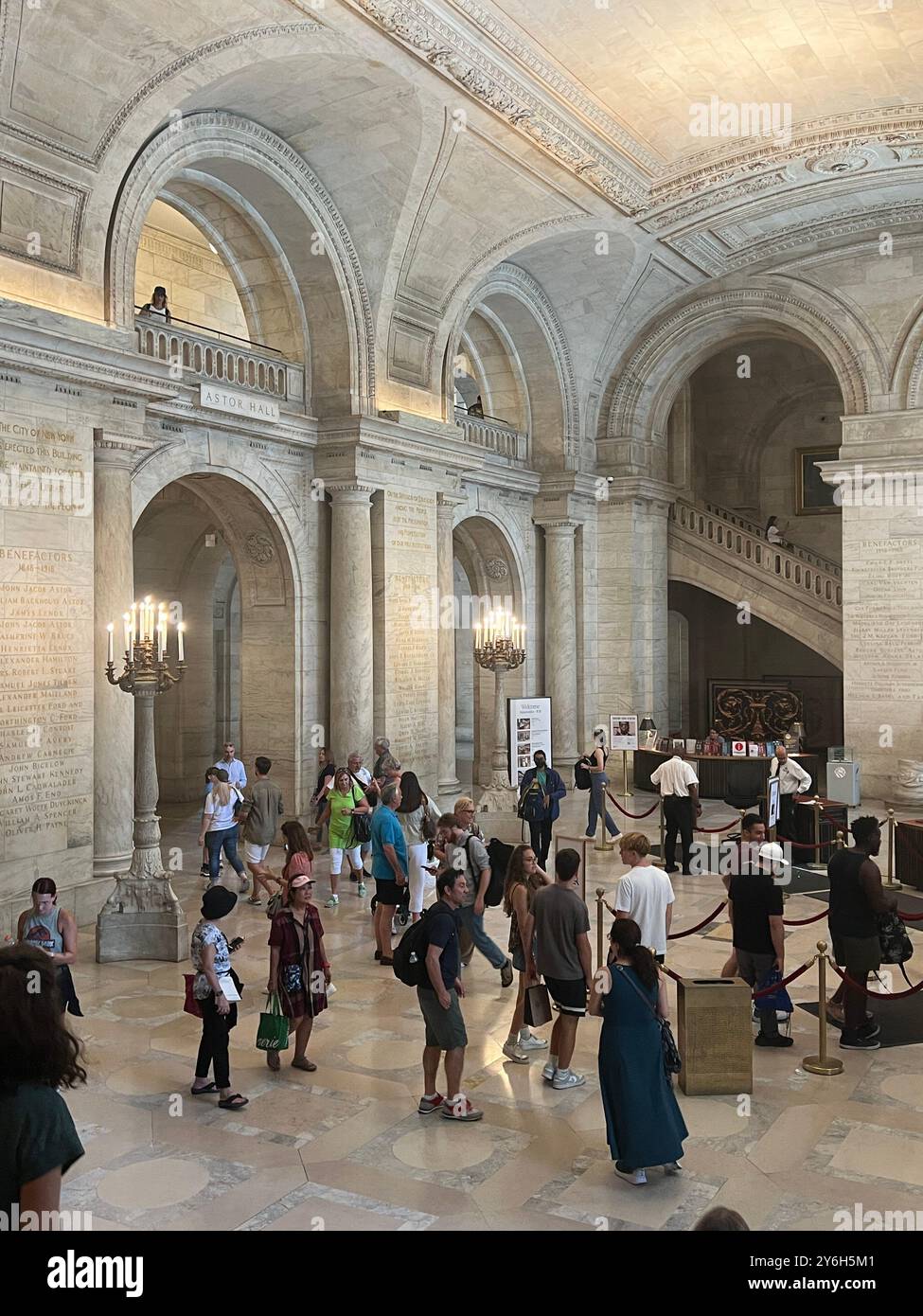 People in the large entrance hall of the New york Public Library at 5th ...