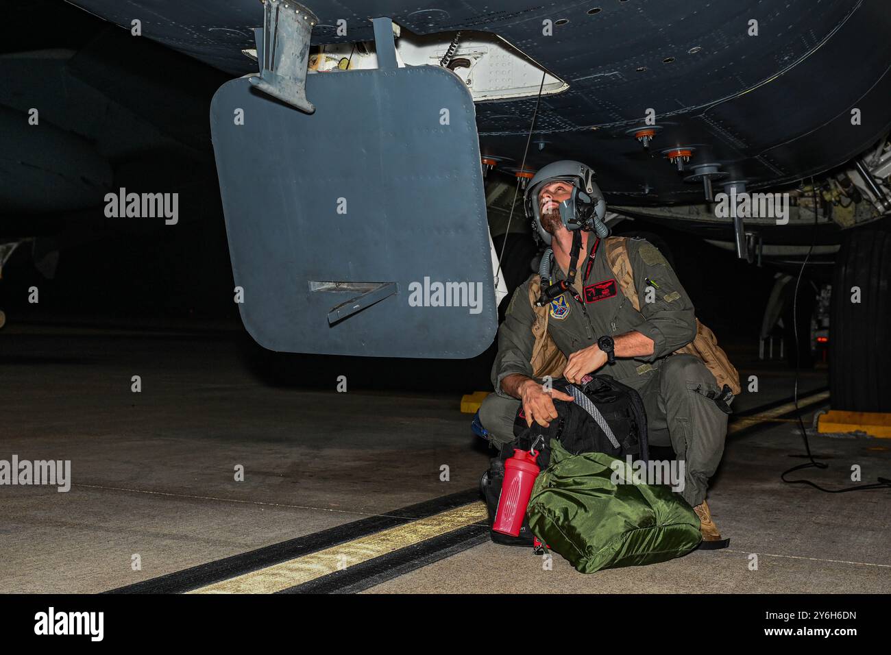 Capt. Adam Shelton, 96th Bomb Squadron pilot, looks inside a B-52H ...