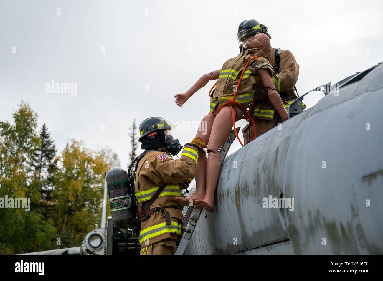 U.S. Air Force Staff Sgt. Stuart Hassel (left) and Senior Airman Luke ...