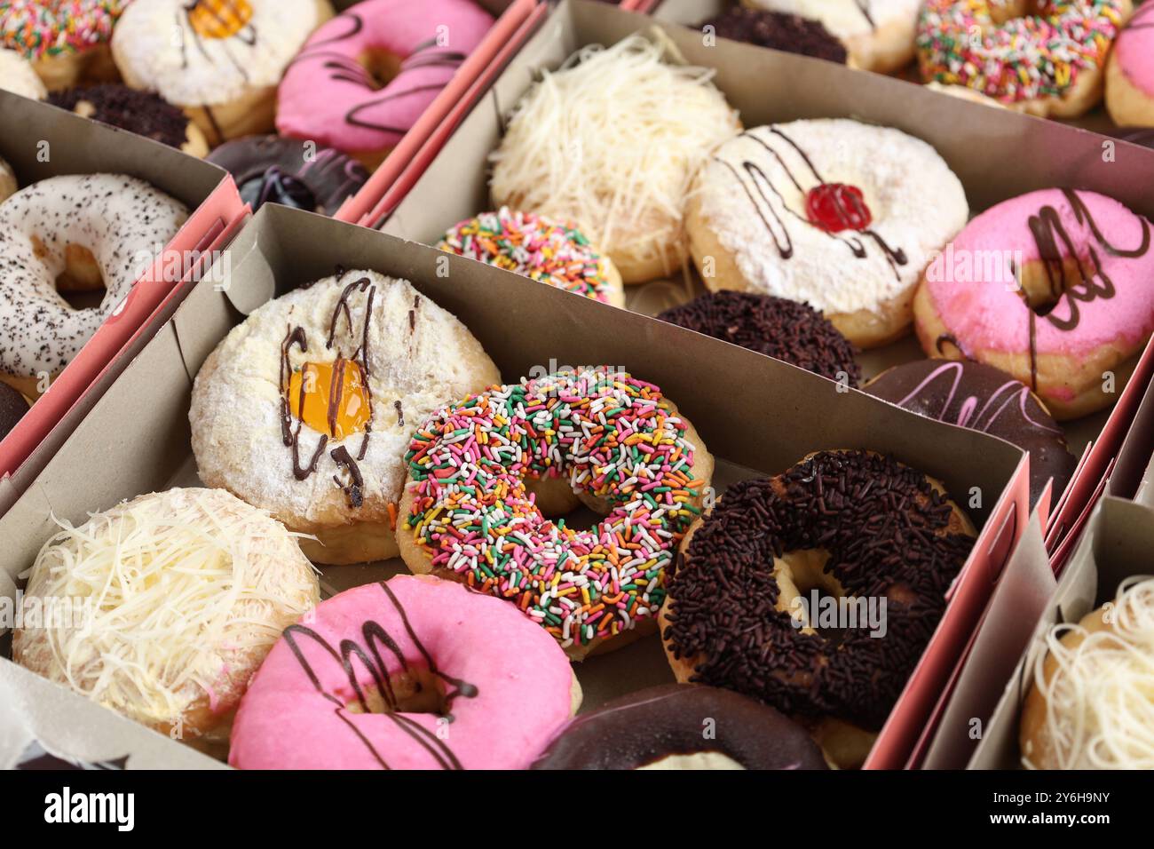 Decorated Donut in Box Packaging, Ready to Sell Stock Photo - Alamy