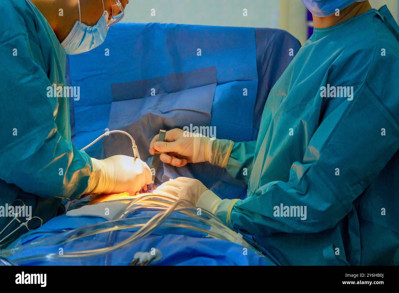 Surgery is performed in operating room of hospital by team surgeons ...