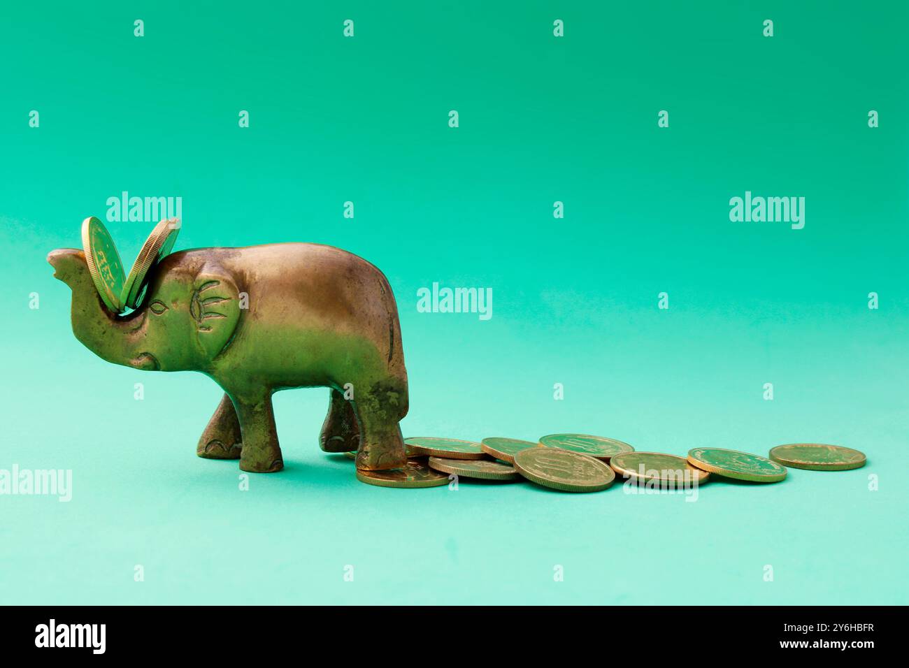 Lucky elephant leaving a trail of golden coins Stock Photo - Alamy