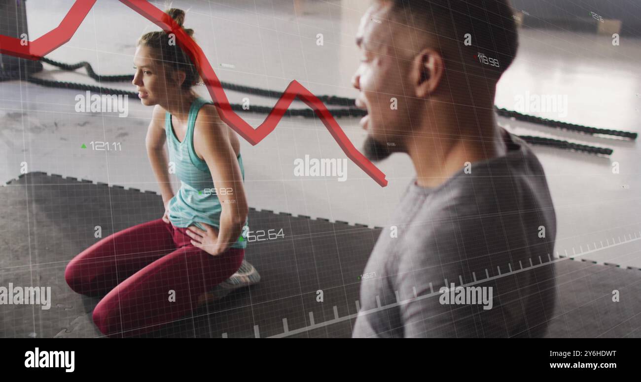 Red line graph image over people exercising in gym Stock Photo - Alamy
