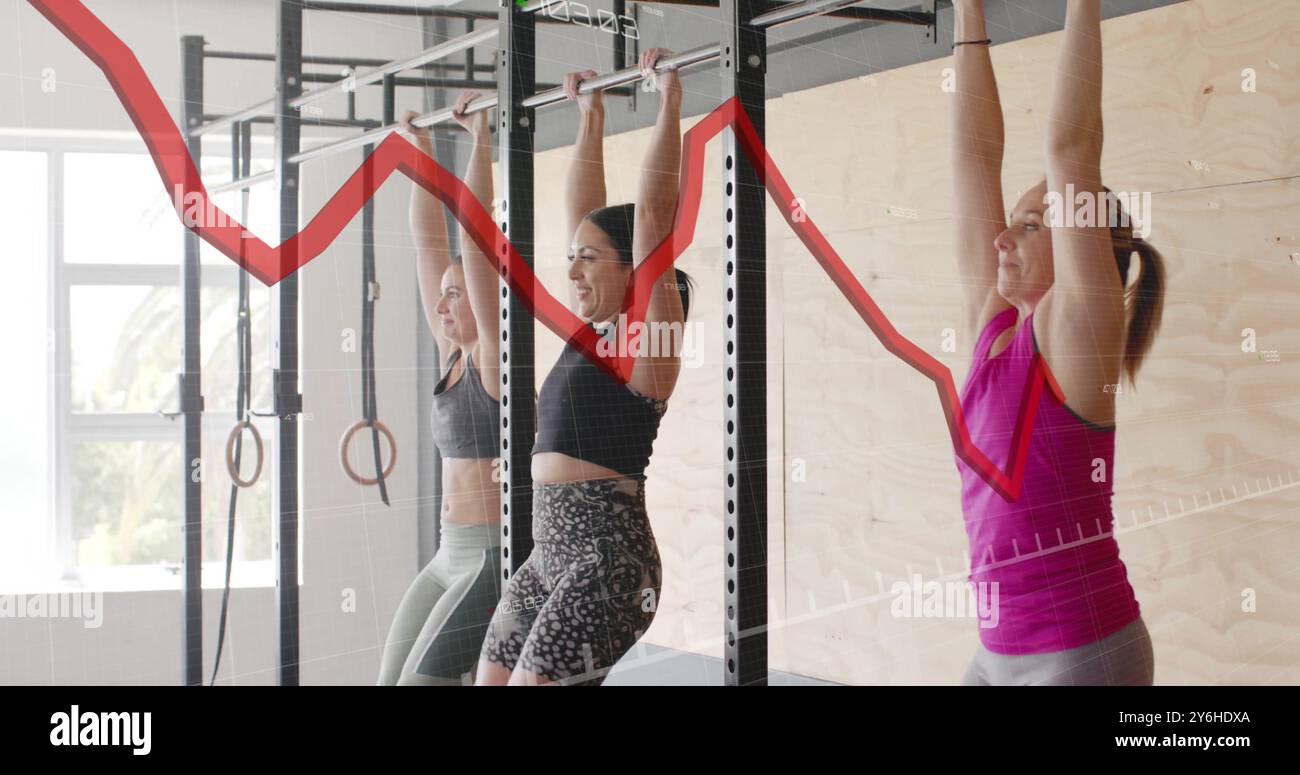 Graph image over women doing pull-ups in gym Stock Photo - Alamy