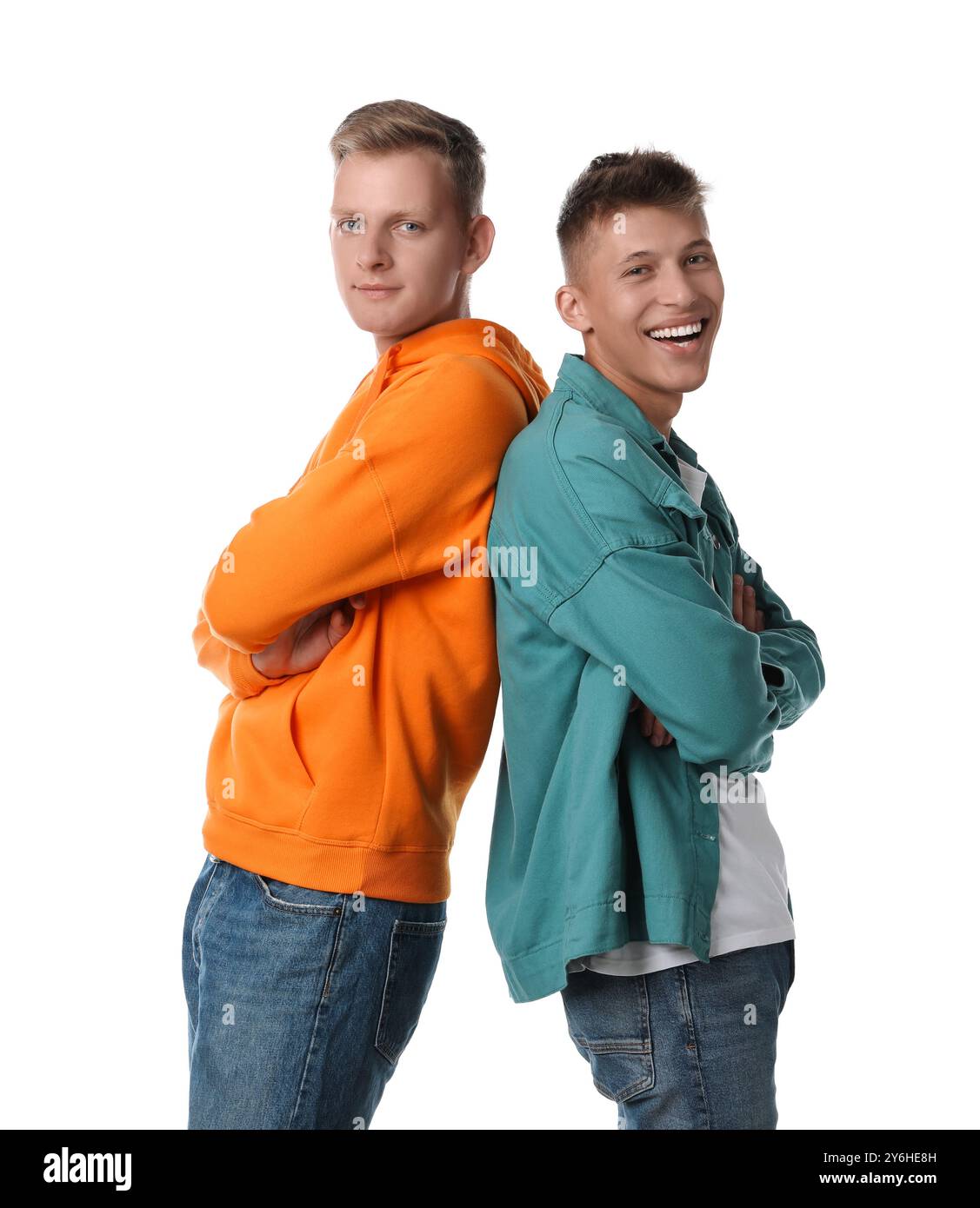 Two happy brothers posing with crossed arms on white background Stock ...