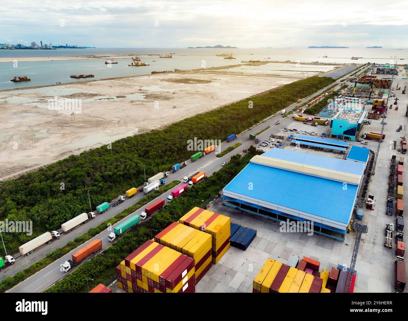Trucks lined up at a warehouse loading dock, preparing for container ...