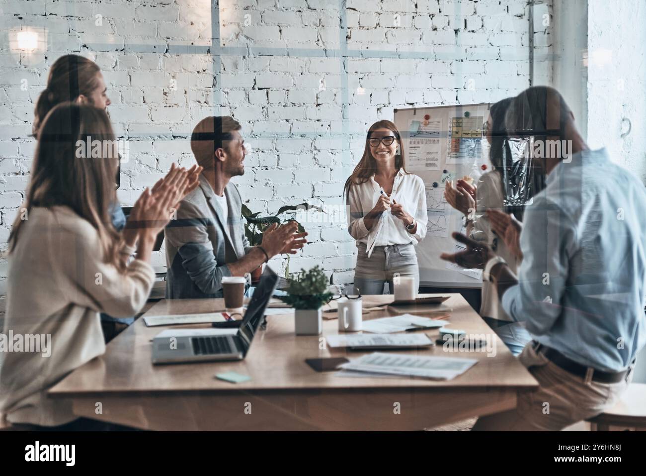 Collaboration is a key to best results. Modern young business people ...