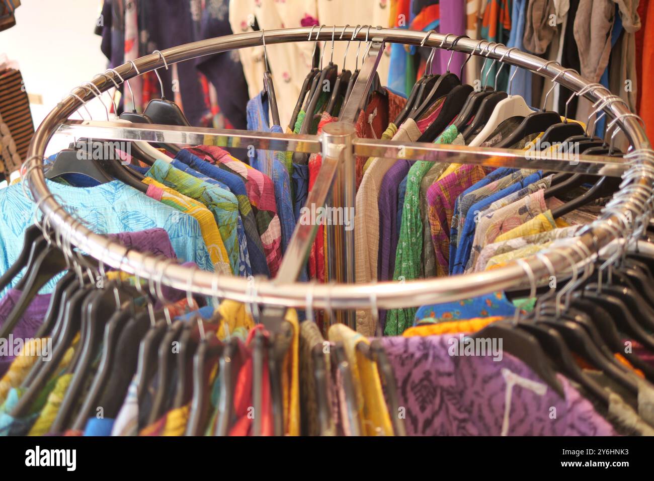A Colorful Clothing Rack Display in a Retail Store Showcasing a Variety ...