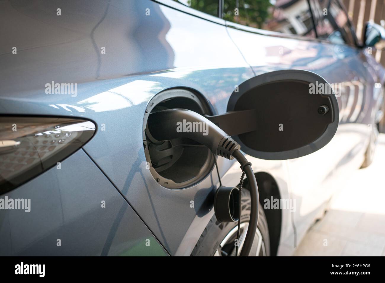 Electric car charging at home, from an installed wallbox Stock Photo ...