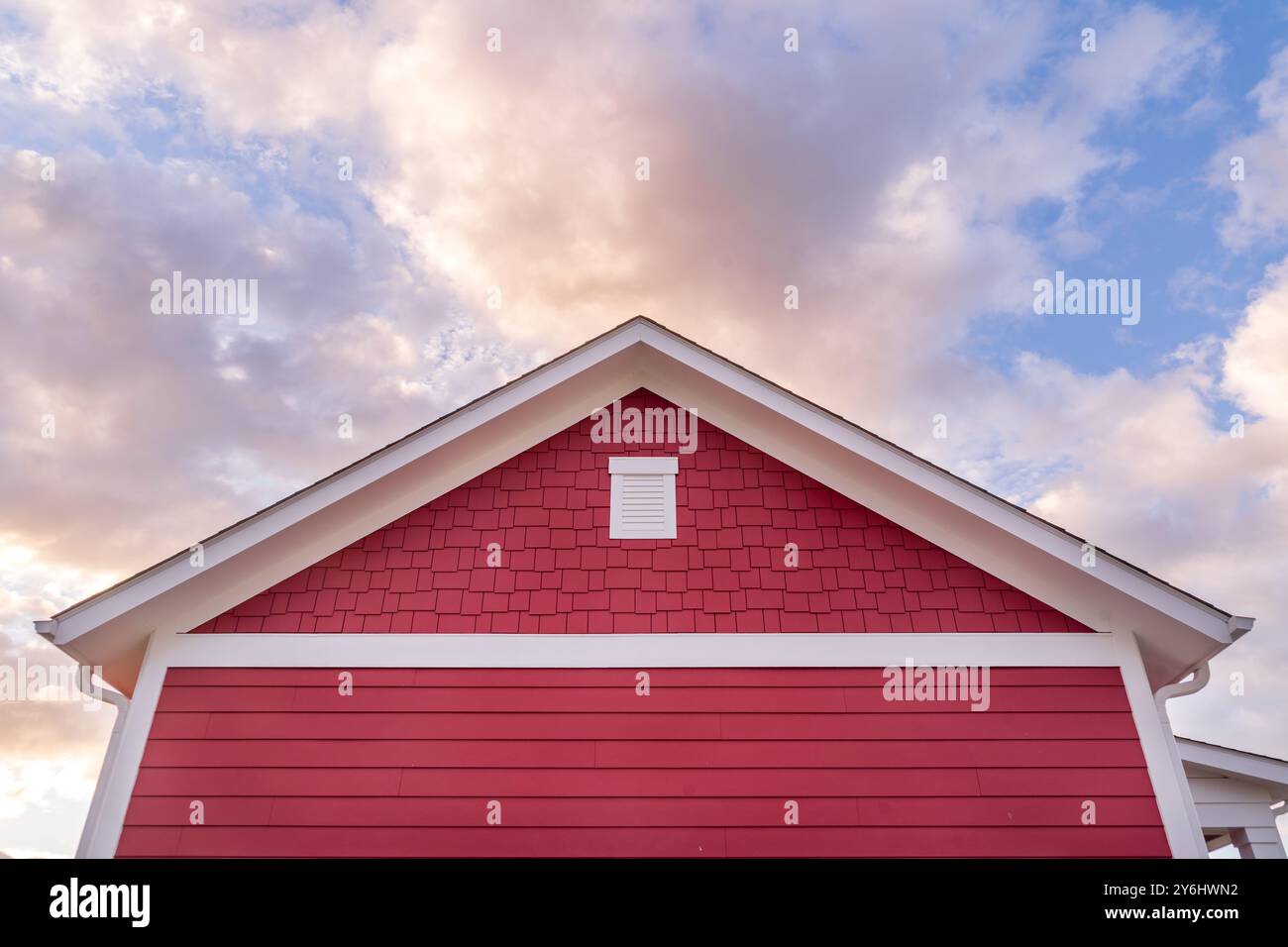 Close up view of Gable roof covered with red Cedar Shake Vinyl Siding ...