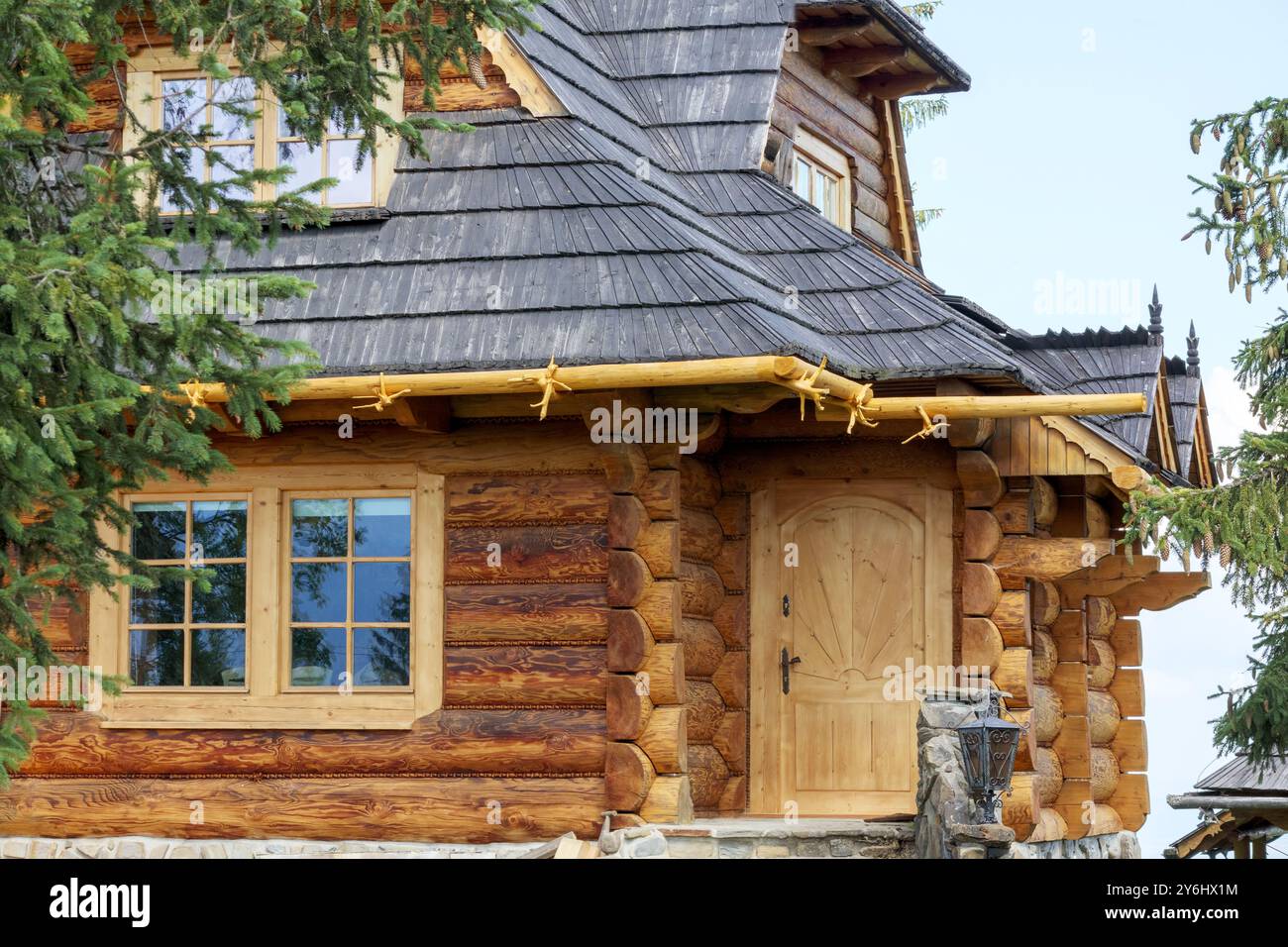 an old log house in the mountains with a wooden shingle roof and a ...