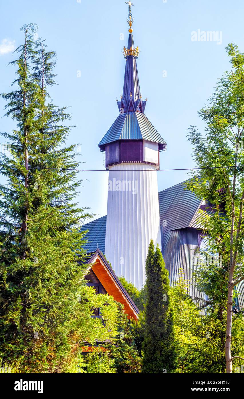 The steeple of the church among green trees Stock Photo - Alamy