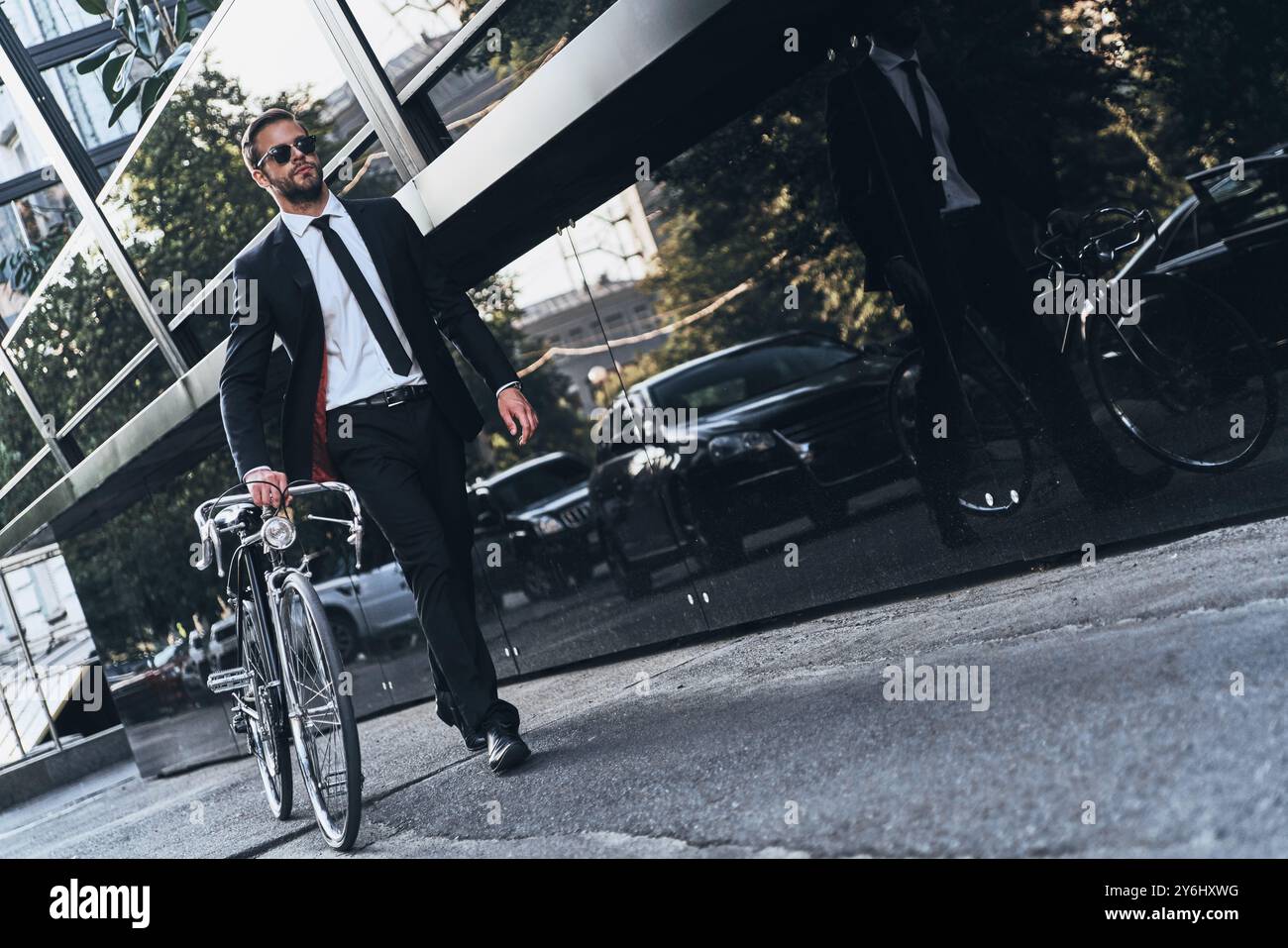 In his own style. Full length of handsome young man in full suit ...