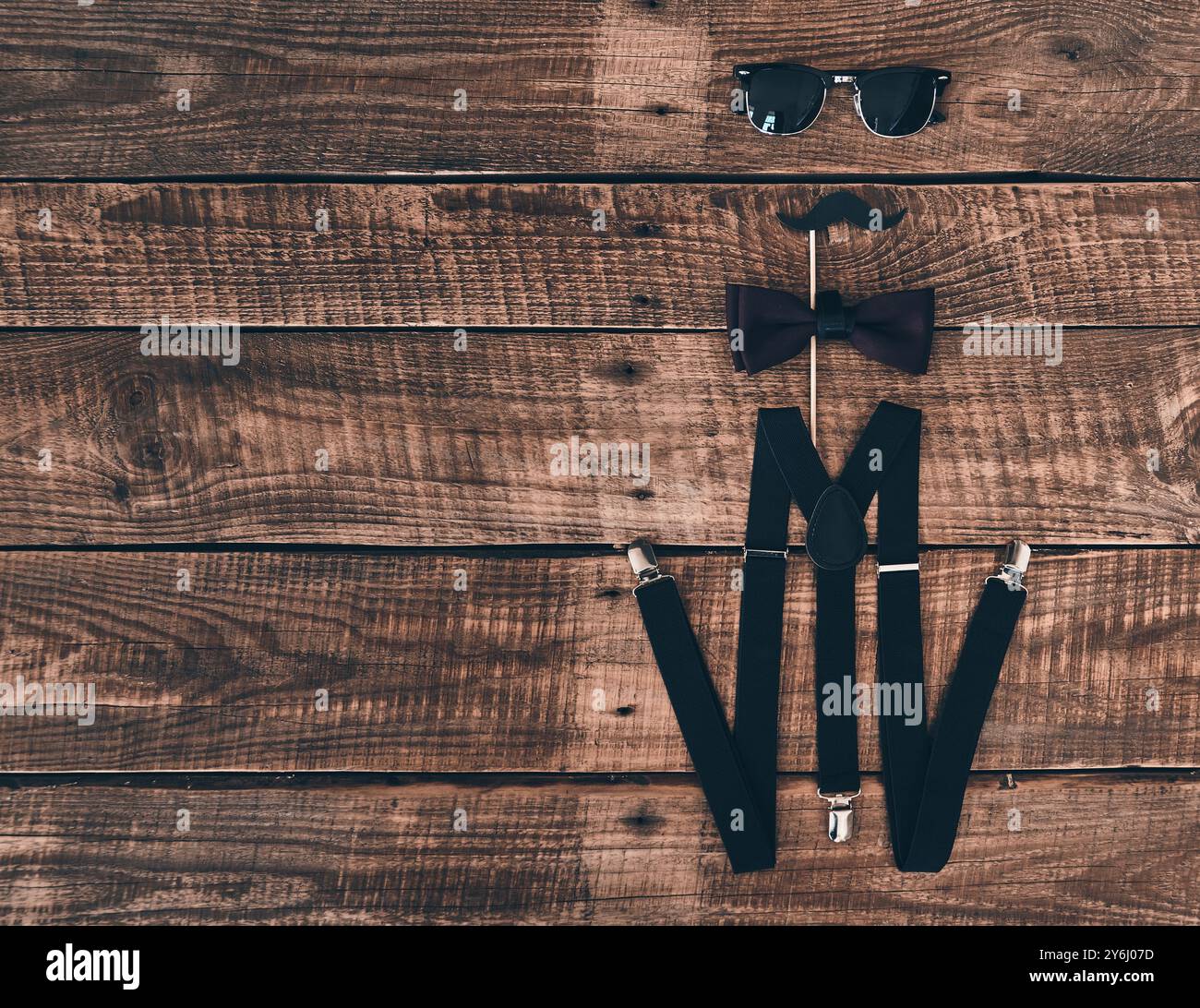 Pure elegance. High angle shot of suspenders, prop, bow tie and eyewear ...