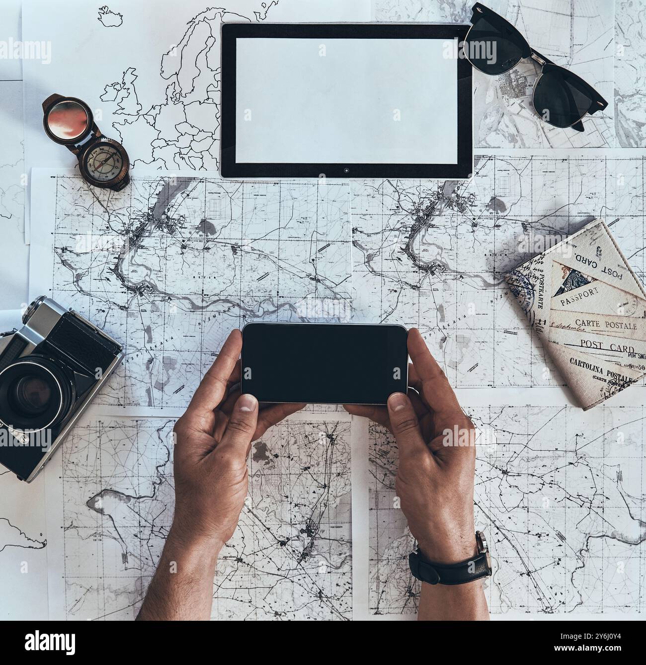 New adventure. Close up top view of man using smart phone with ...