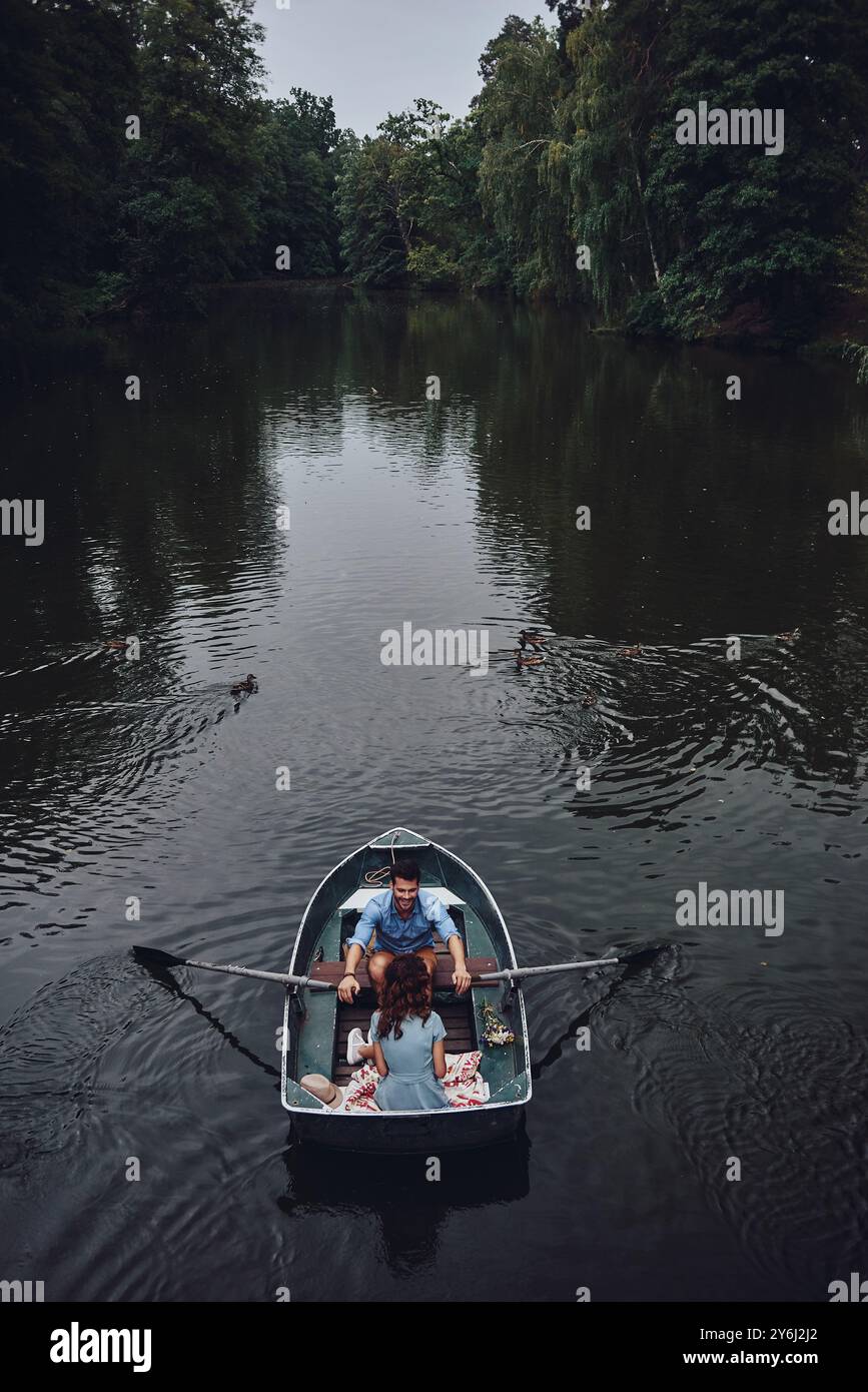 Exploring the world together. Top view of beautiful young couple ...