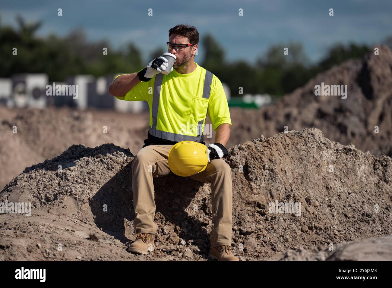 Builder rest. Hispanic worker builder man on site construction ...