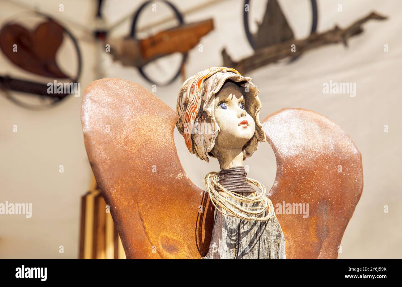 Handcrafted, rustic angel figurine with textured wings, artisan ...