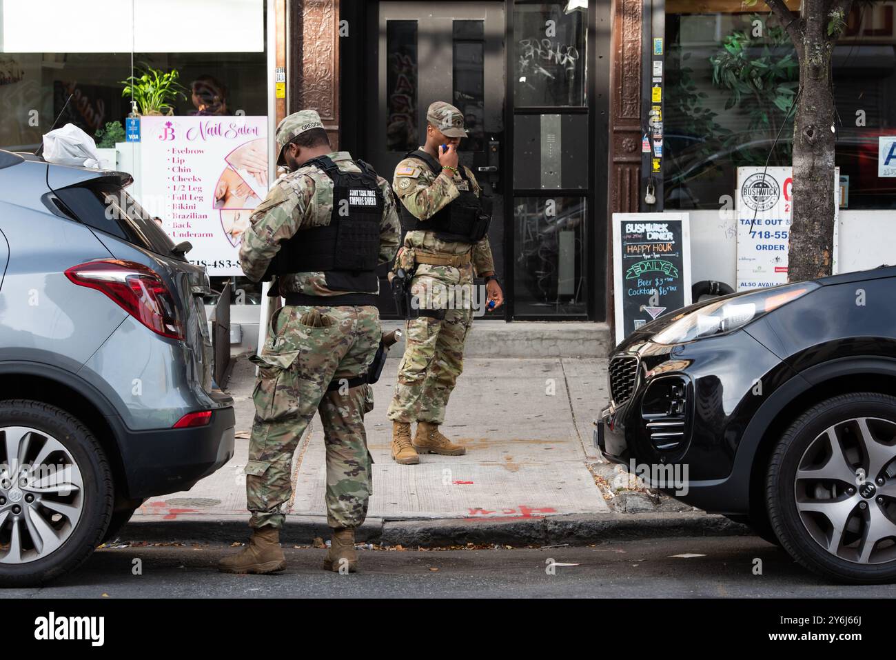Two members of the National Guard in Bushwick, Brooklyn near the Myrtle ...