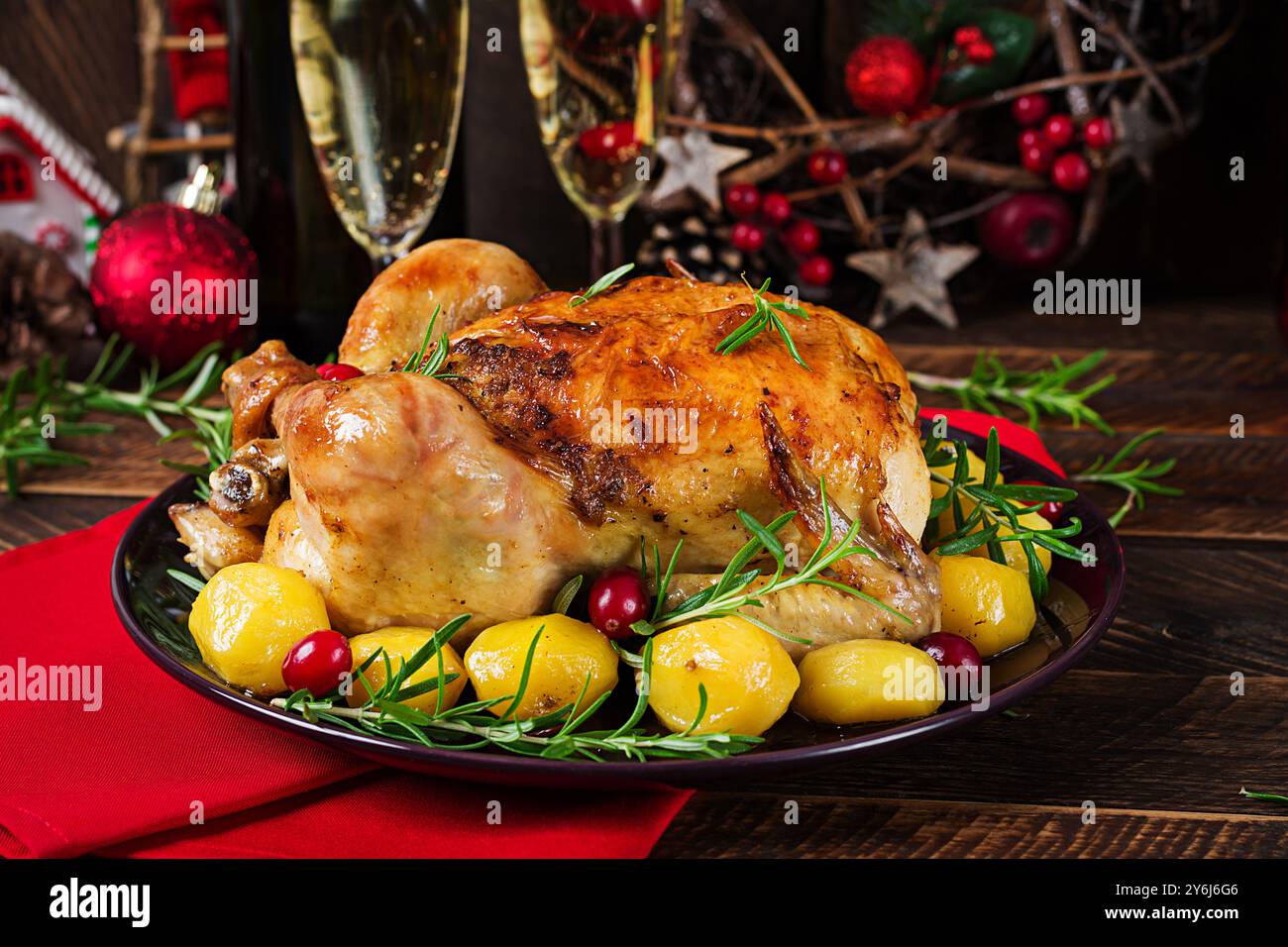 Baked chicken or baked turkey. The Christmas table is served with a ...