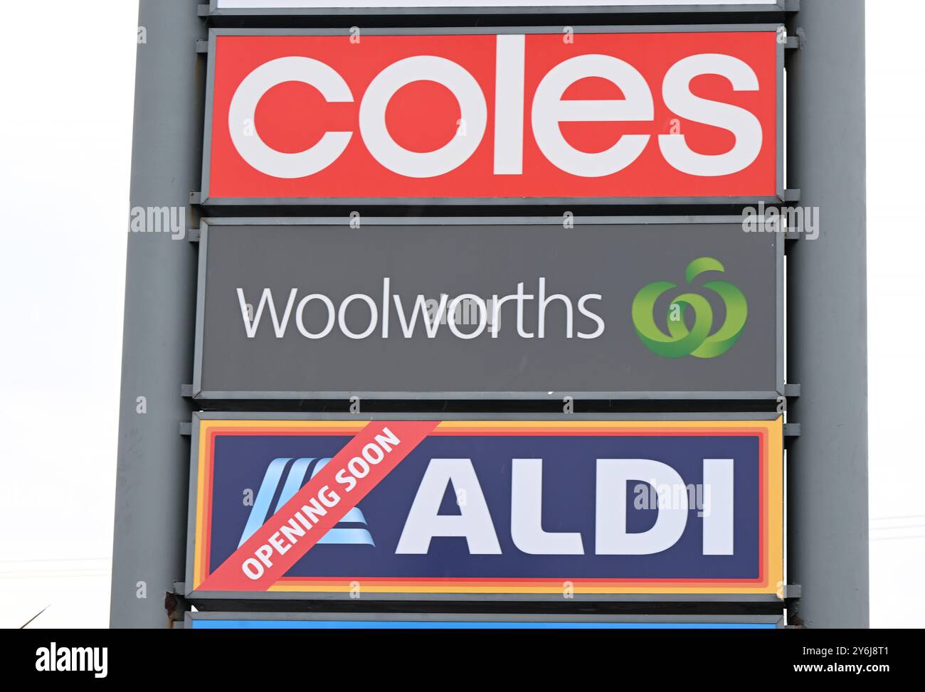 Signage for Australia's three largest Supermarket companies Coles, Woolworths and Aldi are seen ...