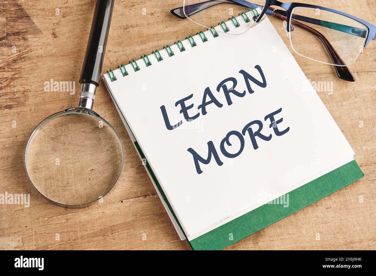 LEARN MORE text in a notebook on a papyrus background, top view Stock ...