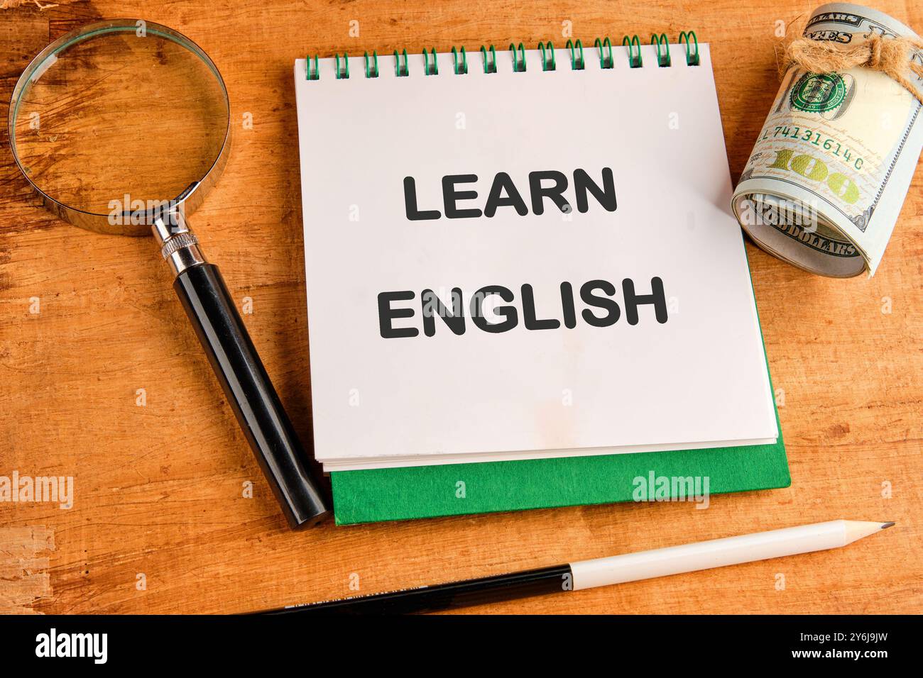 Learn English Text written in a notebook on a papyrus background Stock Photo - Alamy