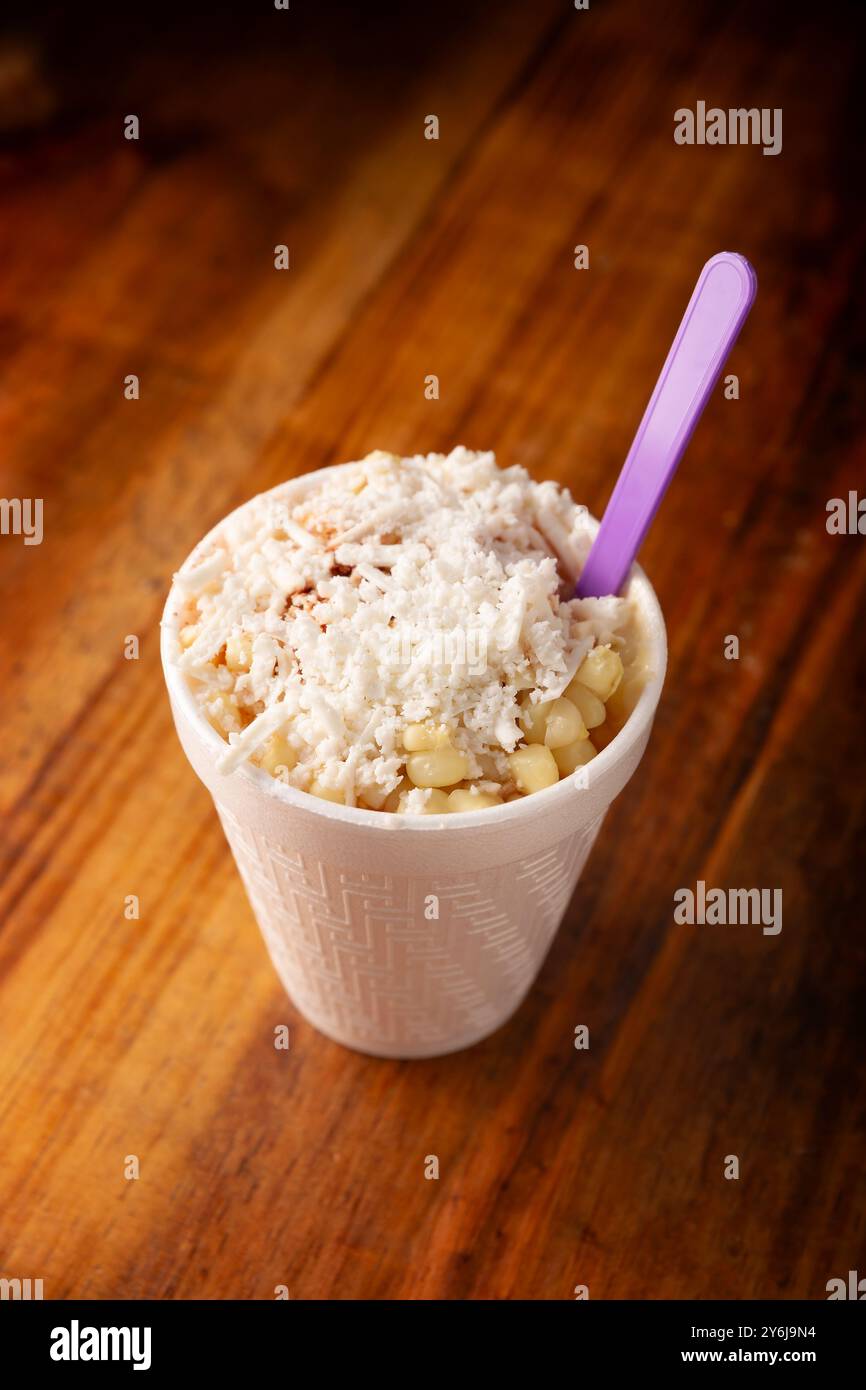 Esquites. Corn kernels cooked and served with mayo, sour cream, lemon ...