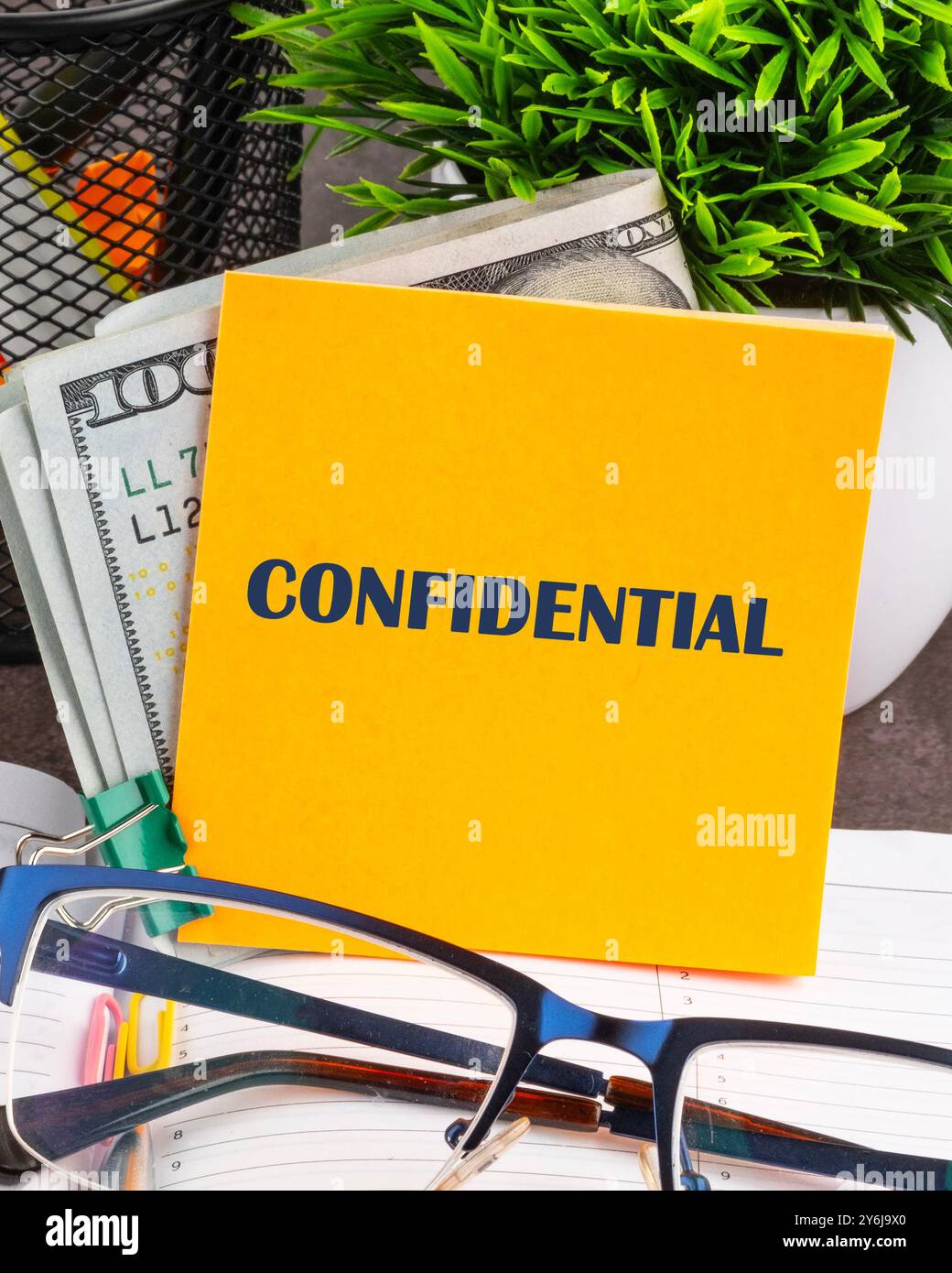 CONFIDENTIAL word alphabet letters on a yellow sticker, vertical ...