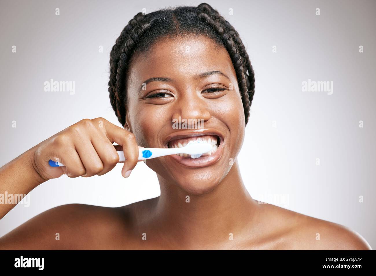 Dental health, portrait and black woman brushing teeth in studio for ...