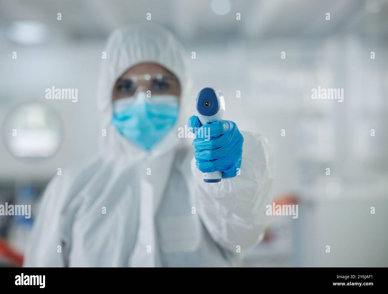 Scientist, portrait and thermometer with hazmat suit for temperature ...